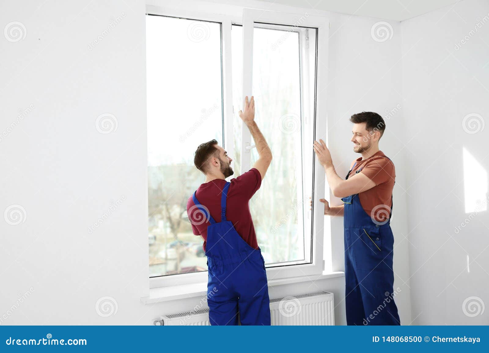 Construction Workers Installing Plastic Window Stock Photo - Image of ...