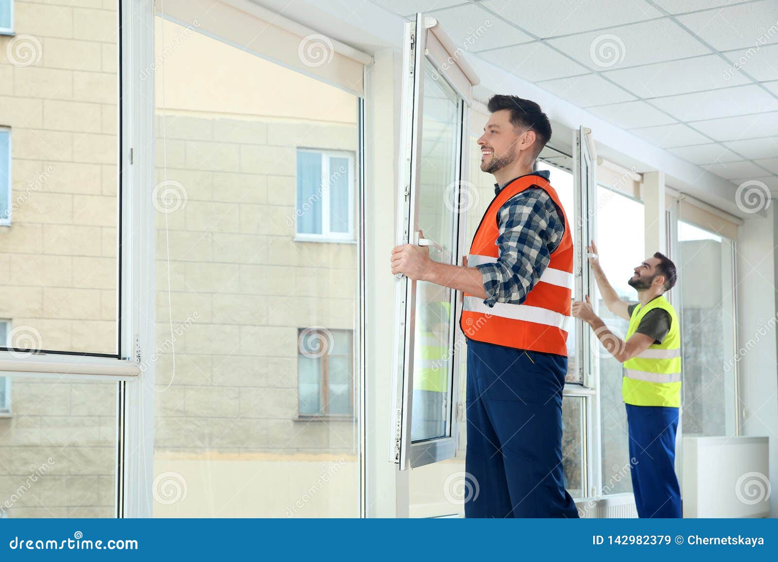 Construction Workers Installing Plastic Windows Stock Image - Image of ...