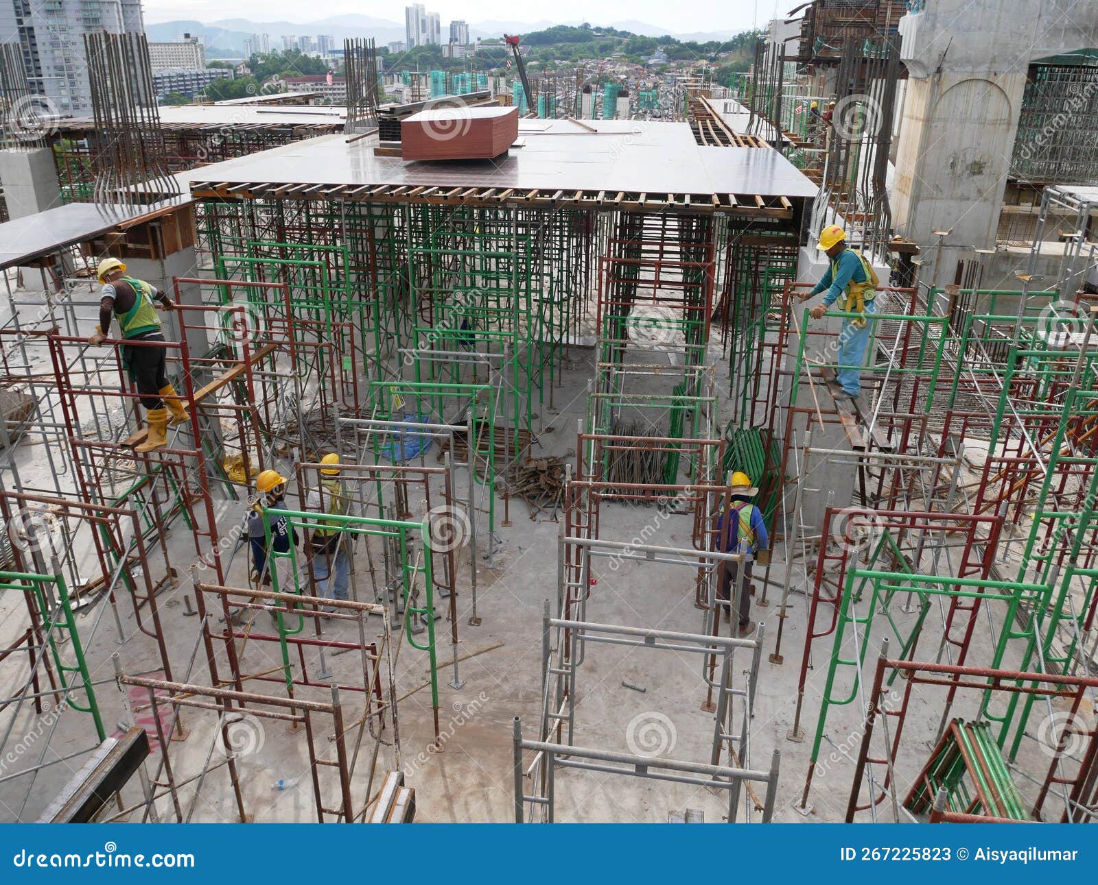 Construction Workers are Installing Scaffolding at a Construction Site ...