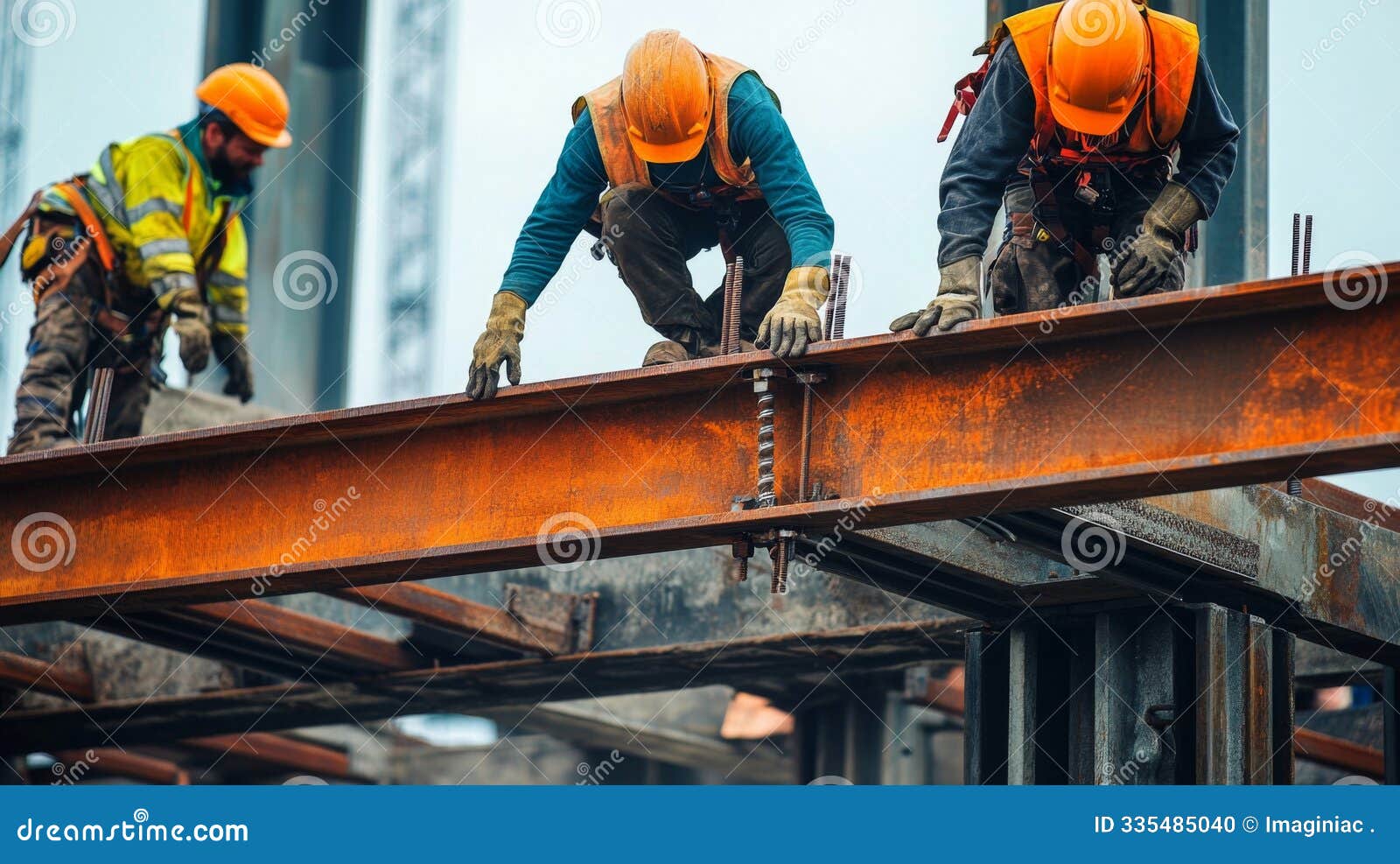 Construction Workers Installing Steel Beam on a Building Stock ...