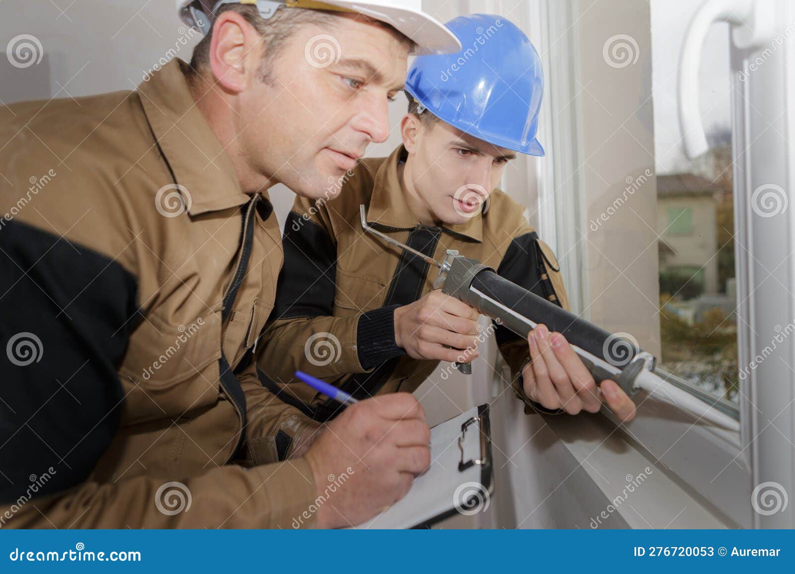 Construction Workers Installing Window in House Stock Image - Image of ...