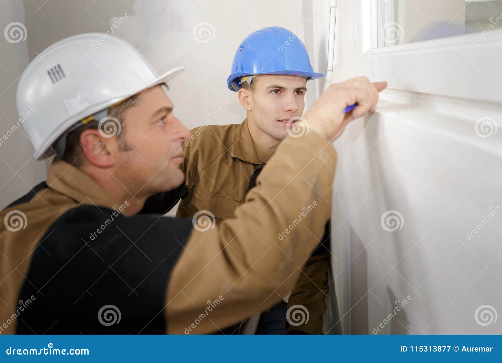 Construction Workers Installing Window in House Stock Image - Image of ...