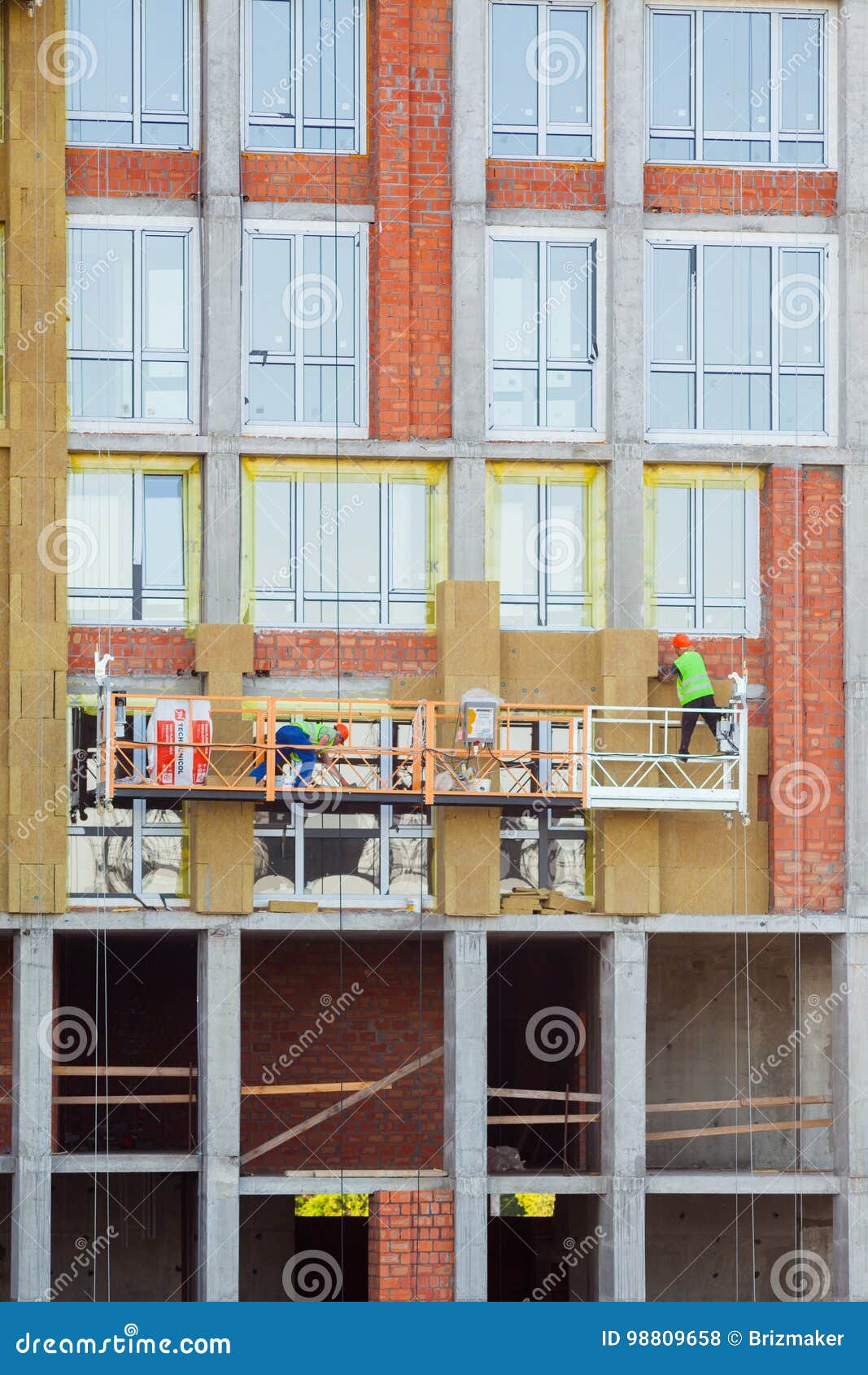 Construction Workers Insulating House Facade With Mineral Rock Wool ...