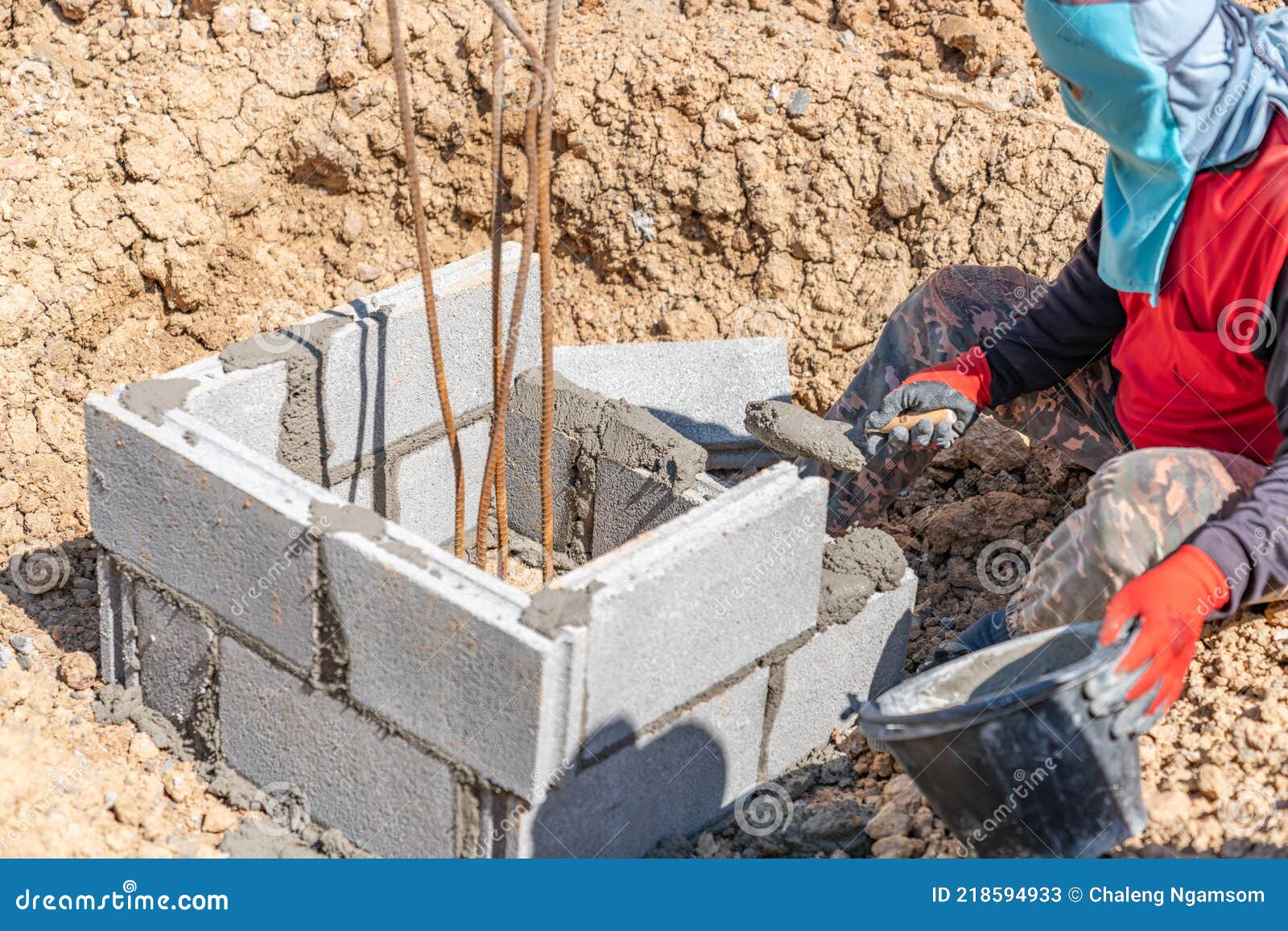 Construction Workers are Laying Bricks Around the Pile Stock Image ...