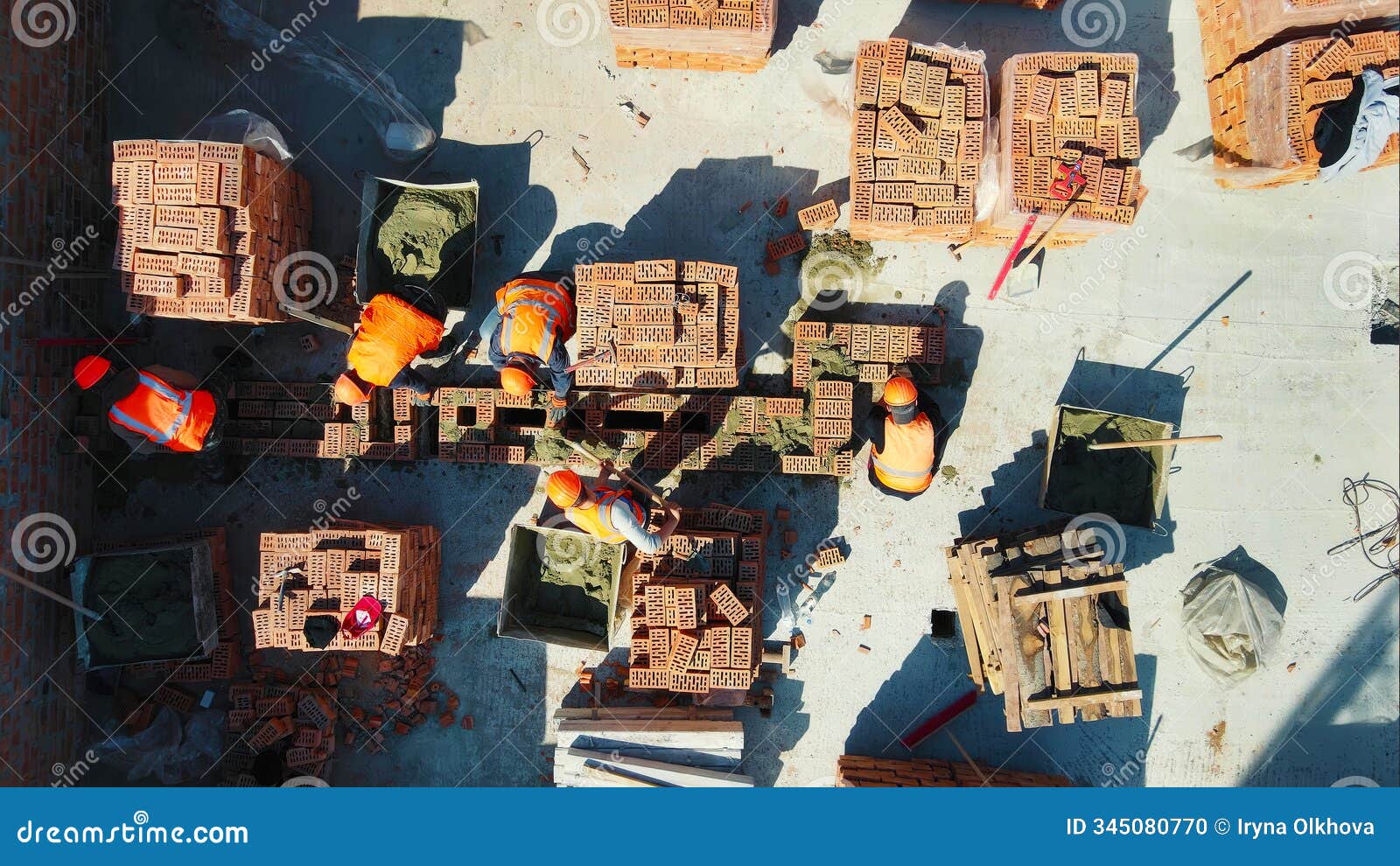 Construction Workers Laying Bricks on a Building Site. a Top-down View ...