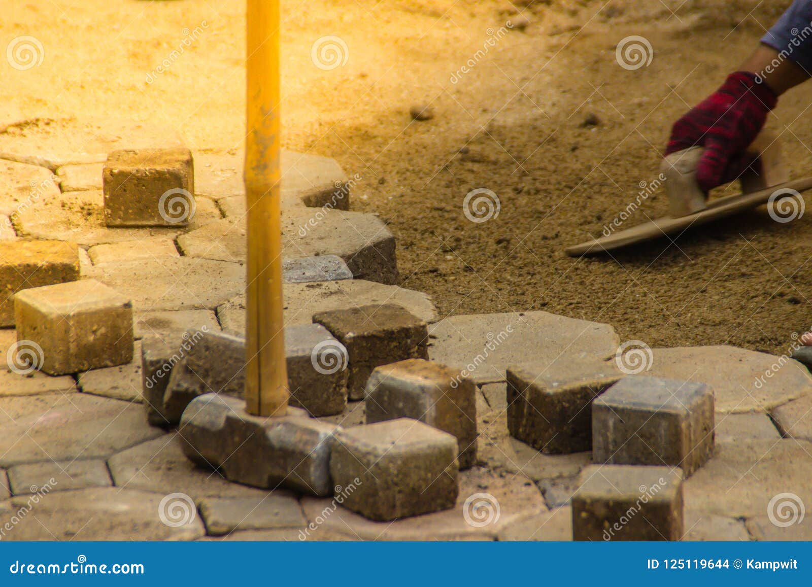 Construction Workers are Laying Concrete Pavement Stone for Footpath ...