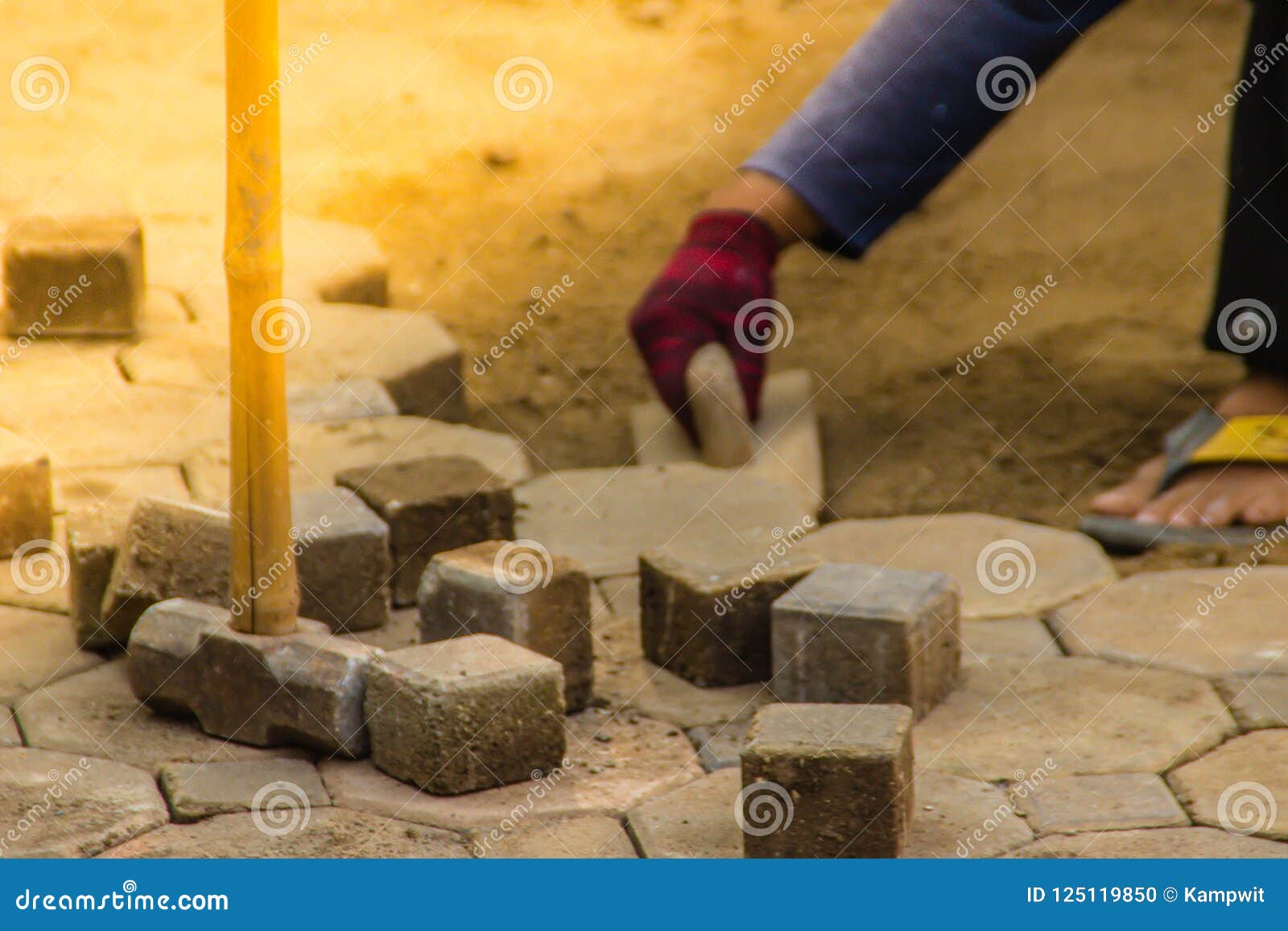 Construction Workers are Laying Concrete Pavement Stone for Footpath ...