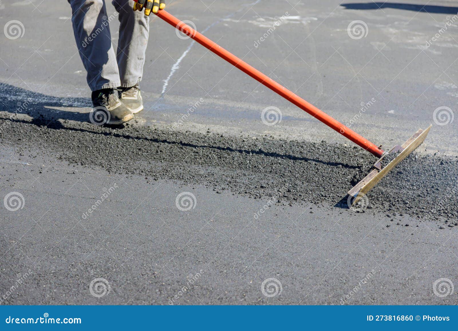 Construction Workers Laying New Asphalt Roads in the Middle of the ...