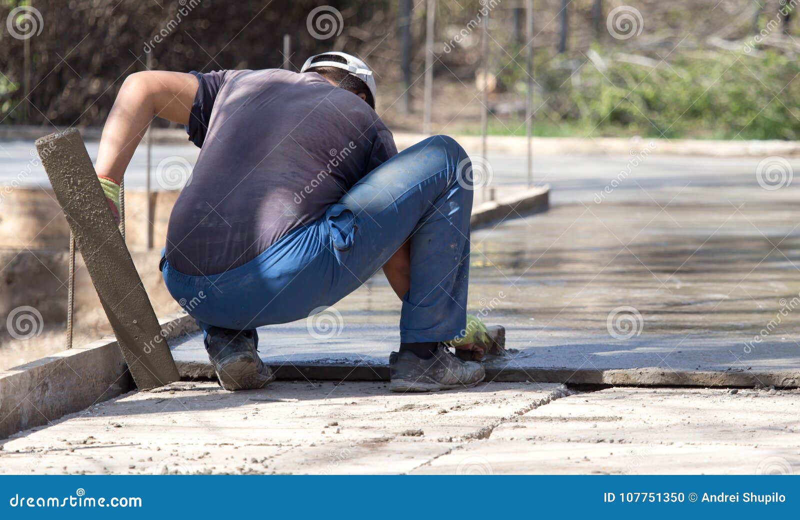 Construction Workers Leveling Concrete Pavement. Editorial Image ...