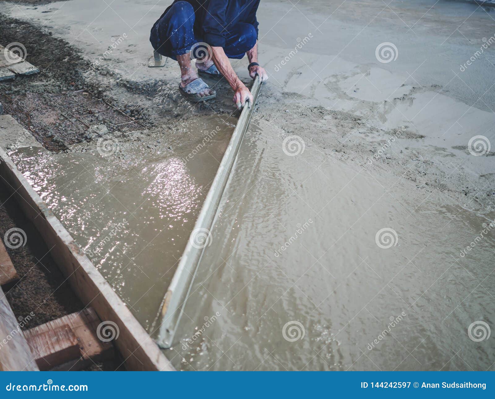 Construction Workers Leveling Poured Liquid Concrete with Trowels Stock ...