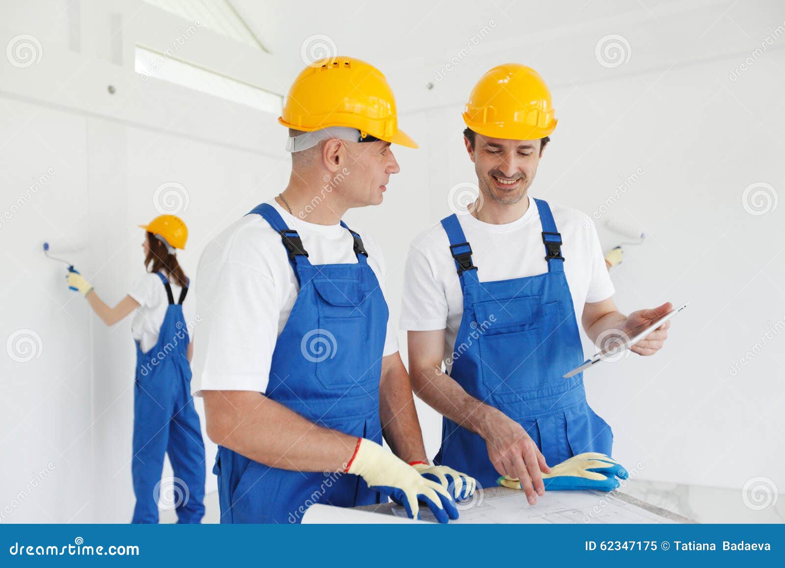 Construction workers stock image. Image of teamwork, plan - 62347175