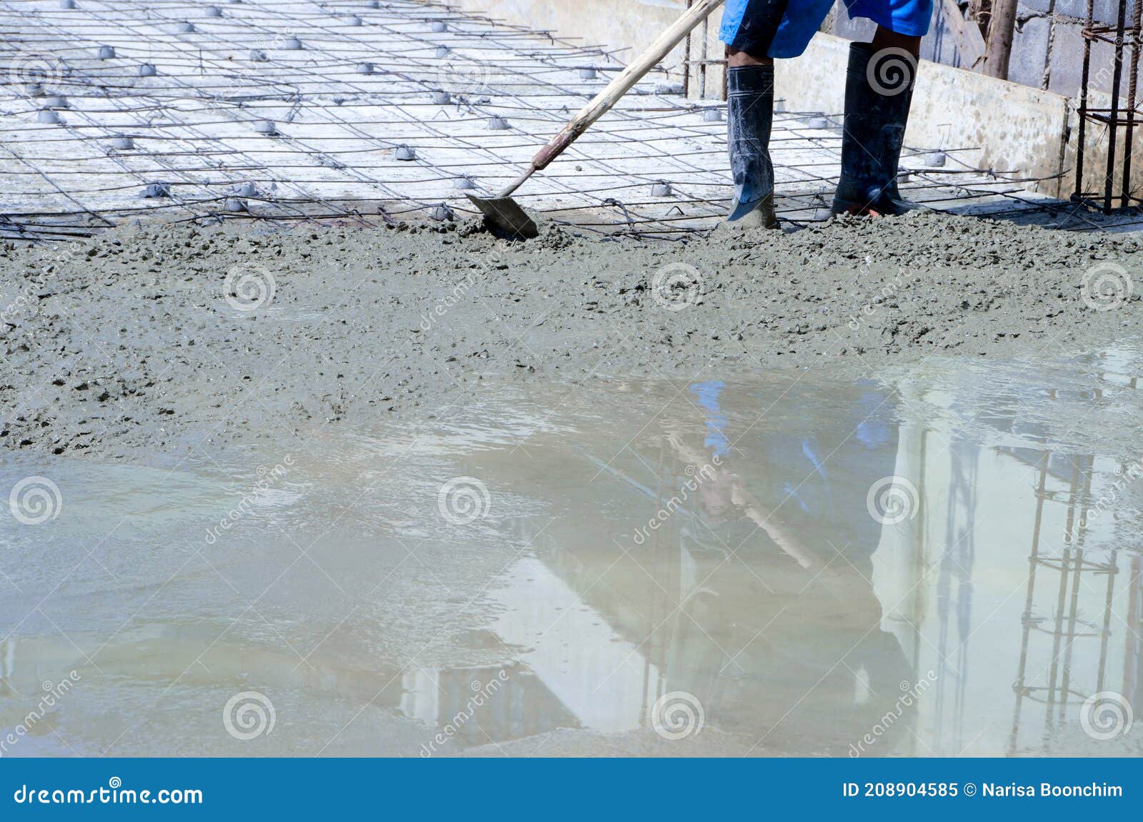 Spread the Cement Mixed with Sandstone and Water Poured into the ...