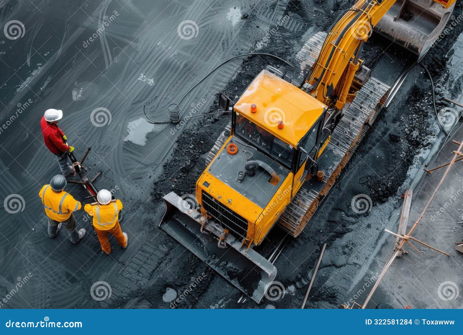Construction Workers Operating Heavy Machinery on a Construction Site ...