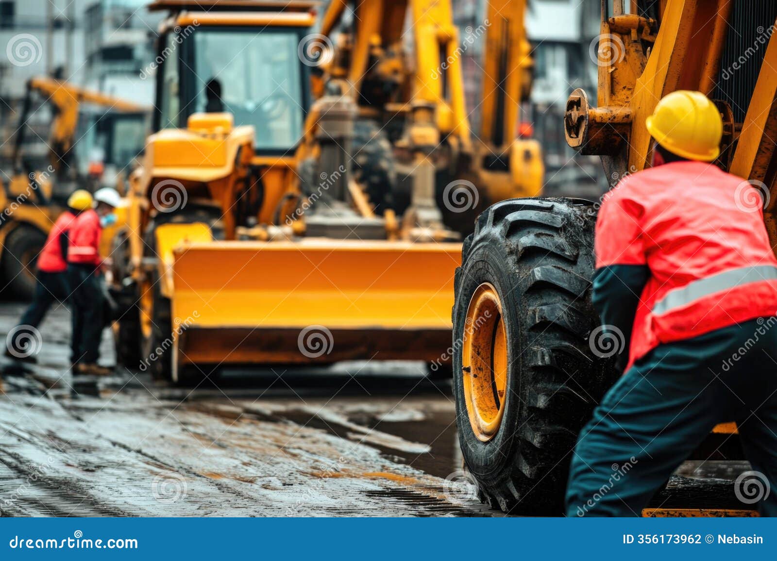 Construction Workers Operating Heavy Machinery on Site Stock Photo ...