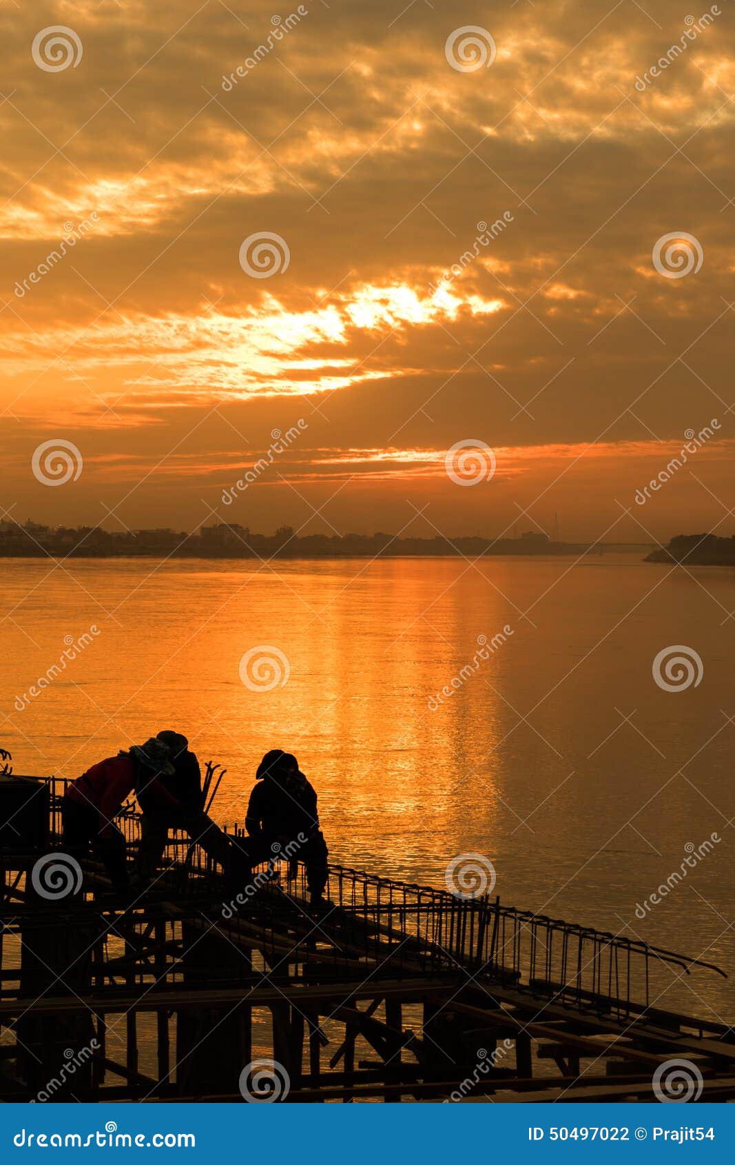 Construction Workers Over Sunset Stock Photo - Image of laborers ...