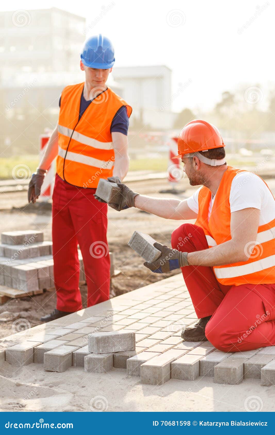 Construction Workers Paving Street Stock Photo - Image of site ...