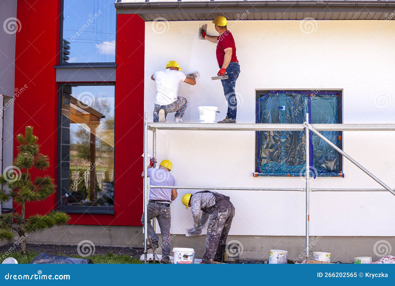 Construction Workers Plaster the Facade of the House. Stock Image ...