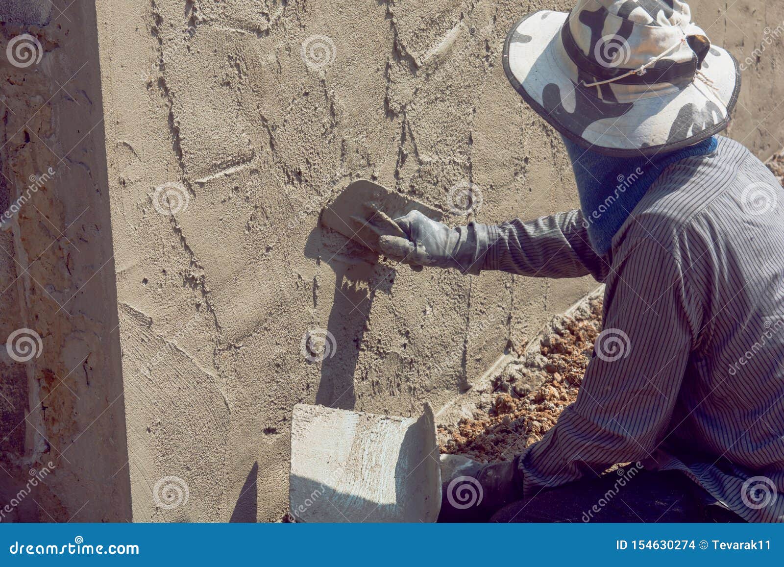 Construction Workers Plastering Building Wall Using Cement Plaster ...