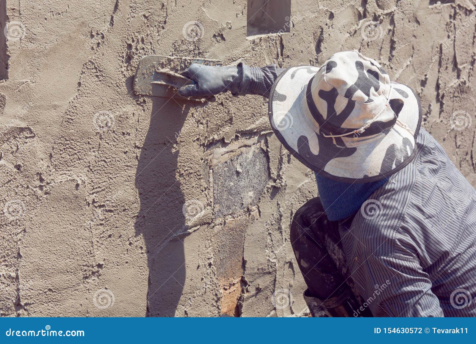 Construction Workers Plastering Building Wall Using Cement Plaster ...