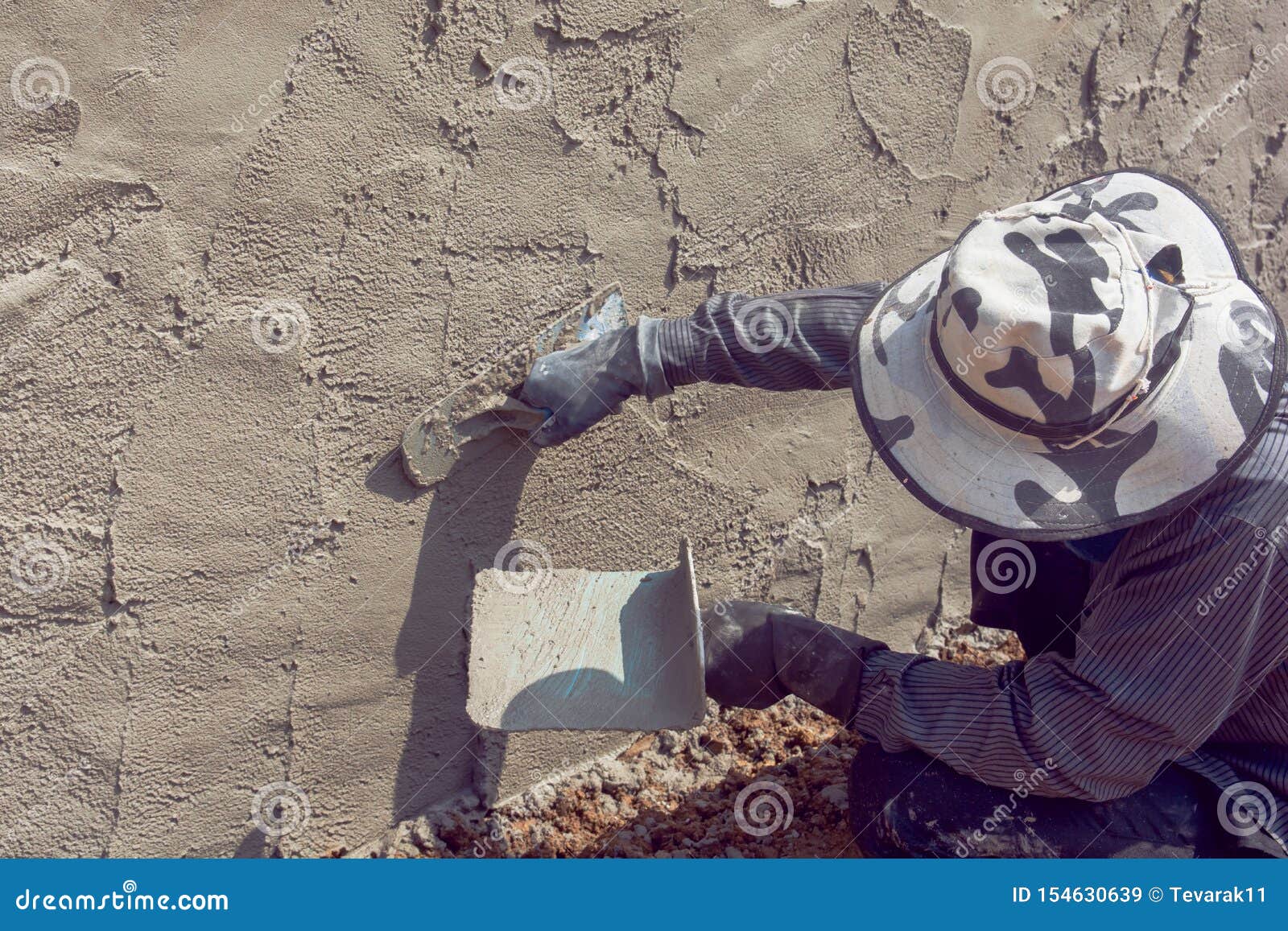Construction Workers Plastering Building Wall Using Cement Plaster ...