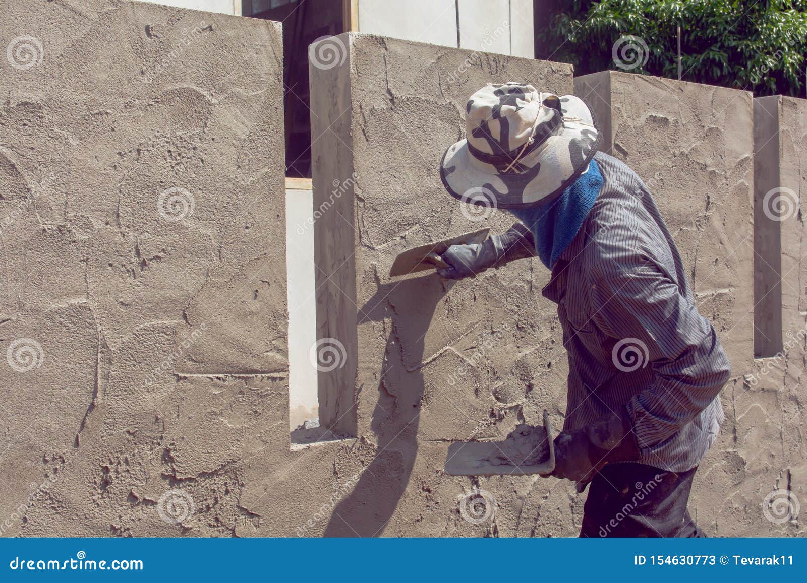 Construction Workers Plastering Building Wall Using Cement Plaster ...