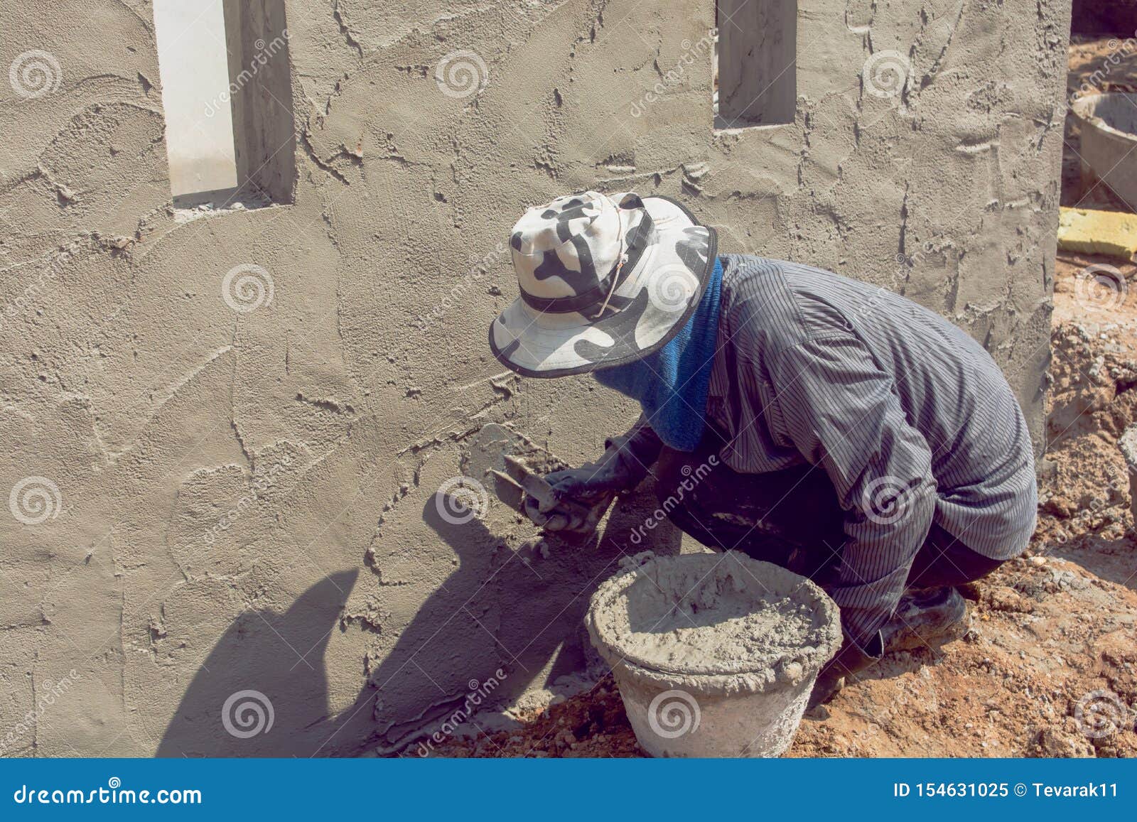 Construction Workers Plastering Building Wall Using Cement Plaster ...