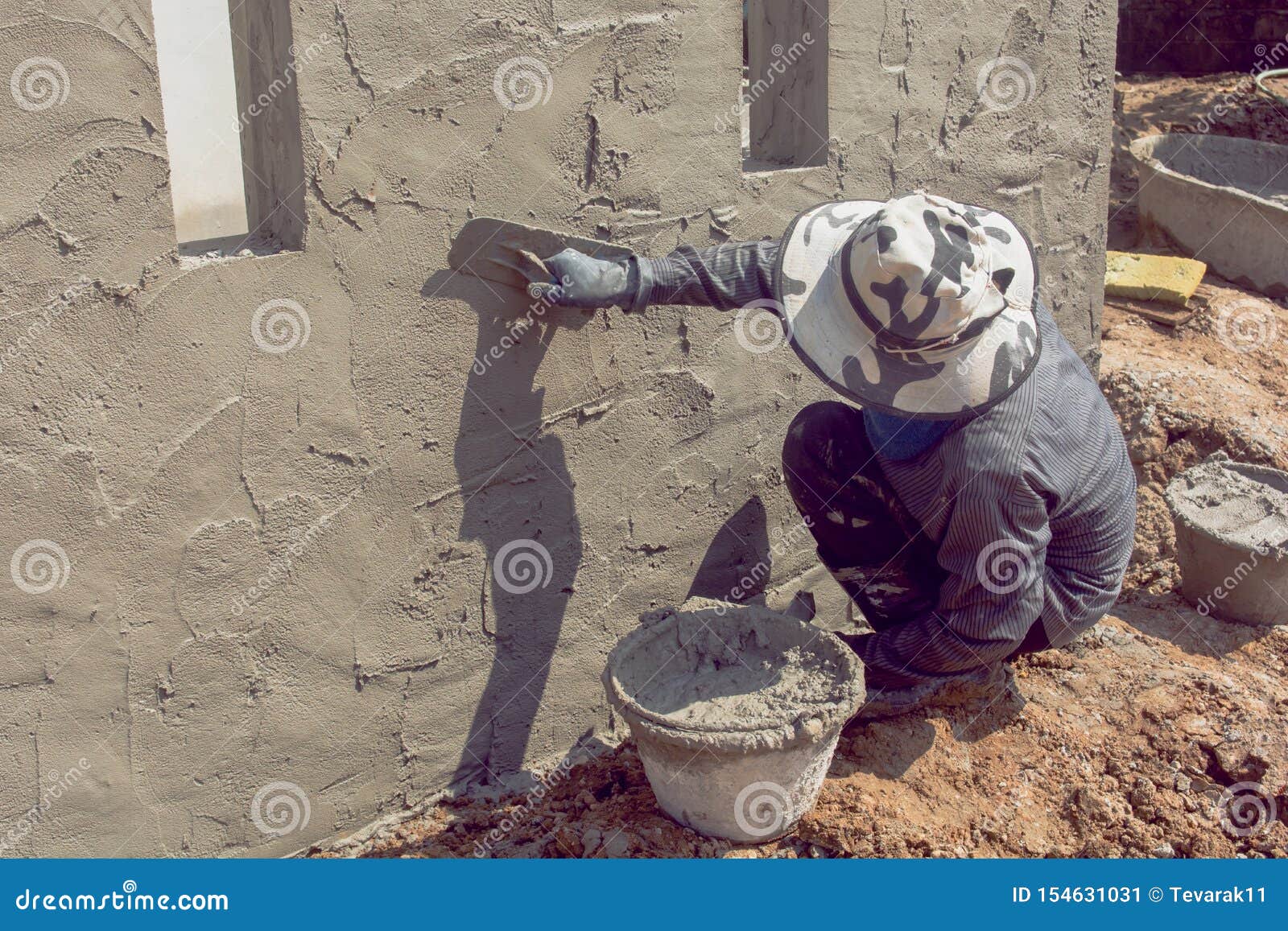 Construction Workers Plastering Building Wall Using Cement Plaster ...