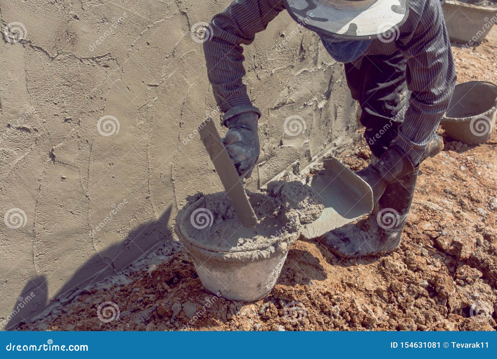 Construction Workers Plastering Building Wall Using Cement Plaster ...