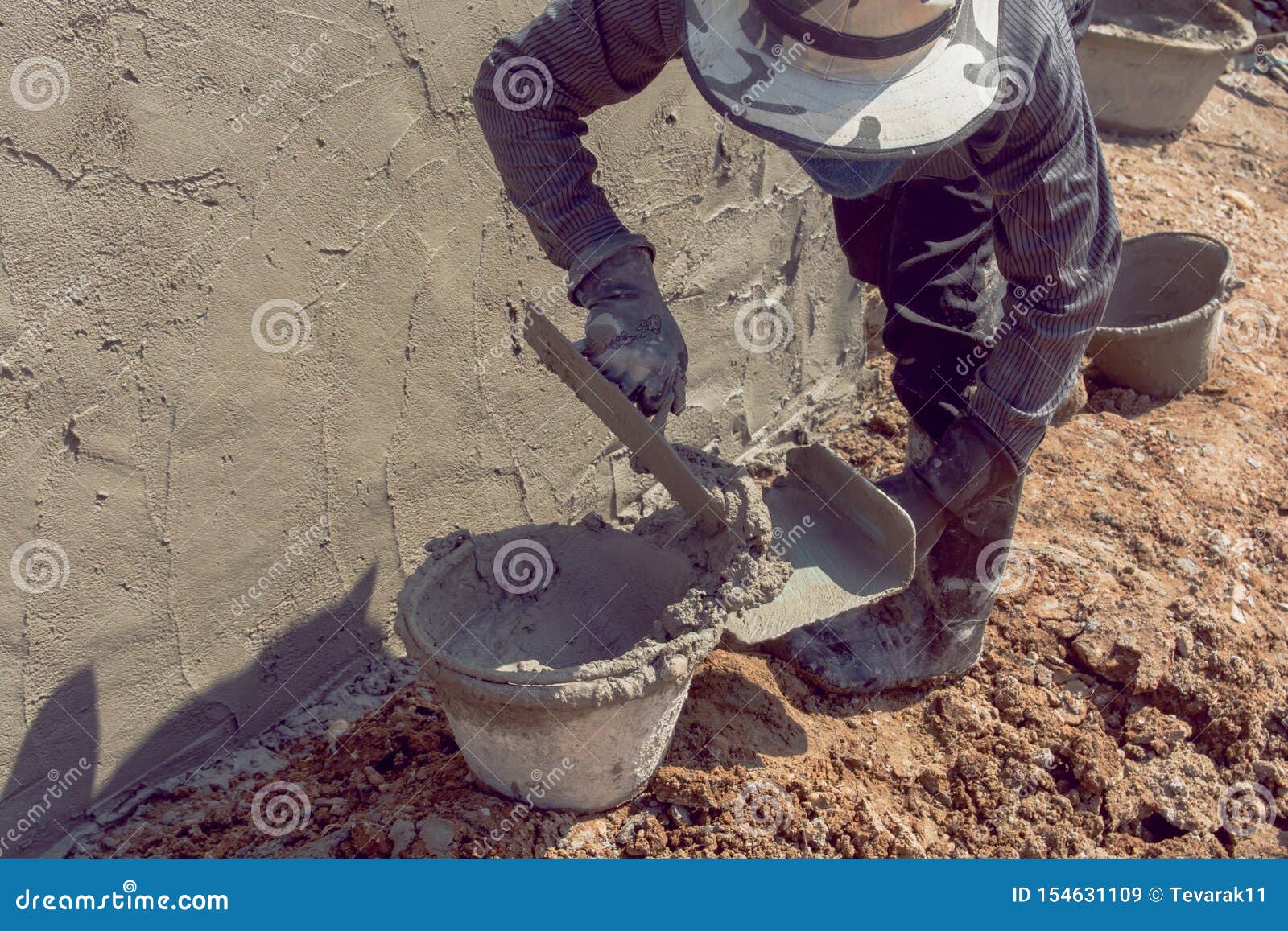 Construction Workers Plastering Building Wall Using Cement Plaster ...