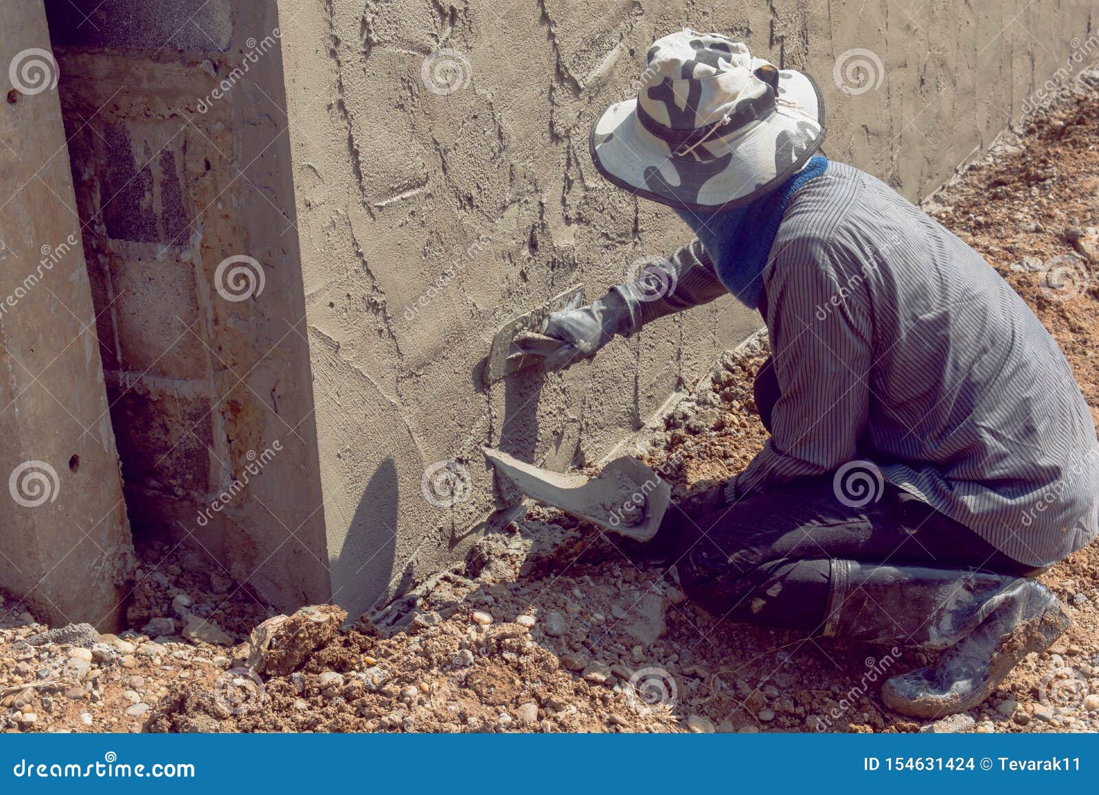 Construction Workers Plastering Building Wall Using Cement Plaster ...