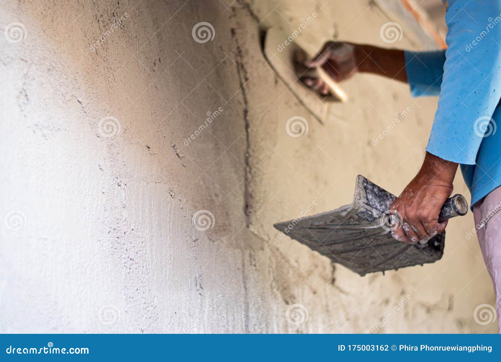 Construction Workers are Plastering the Cement for Building Walls with ...