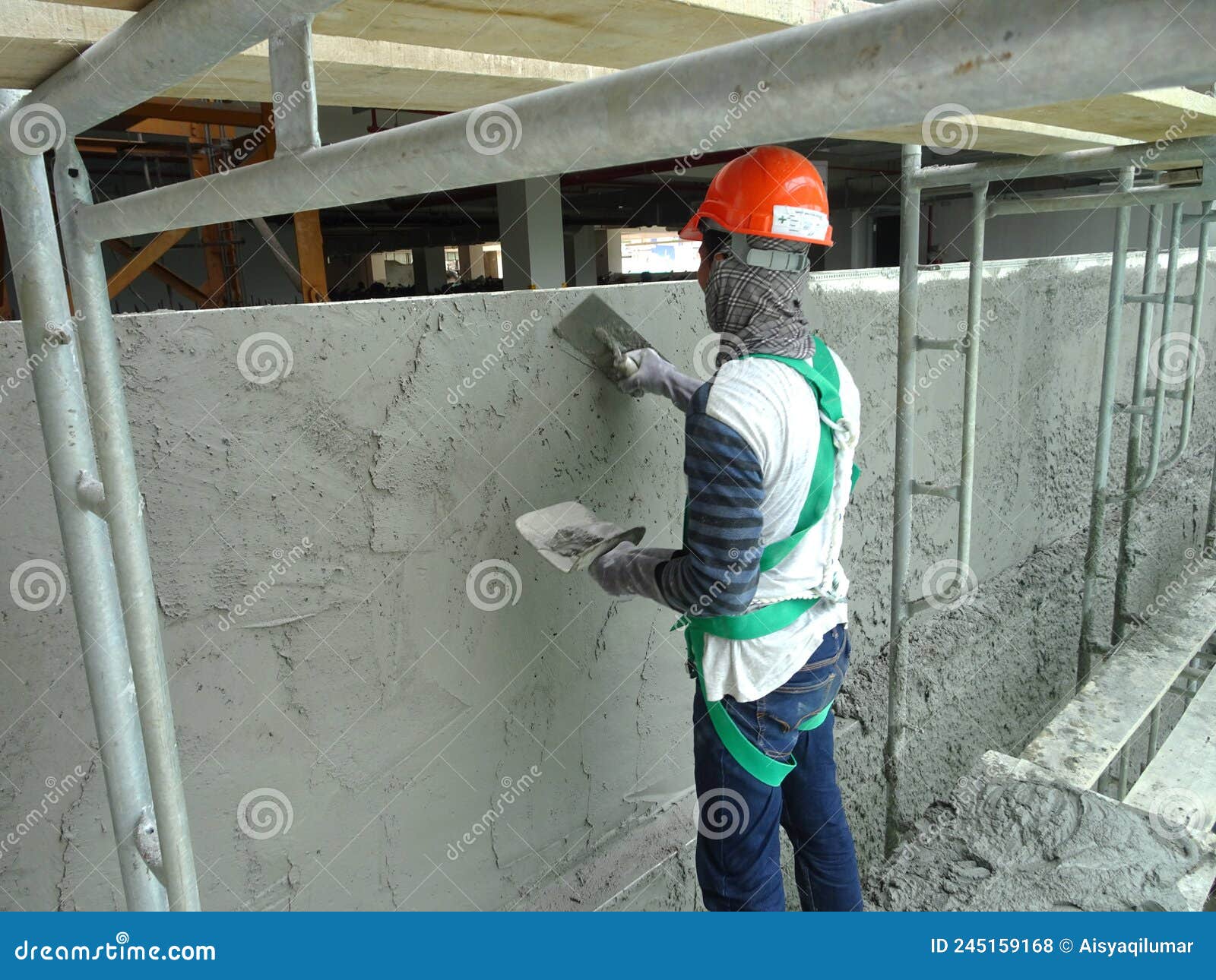Construction Workers Plastering Wall Using Cement Plaster at the ...