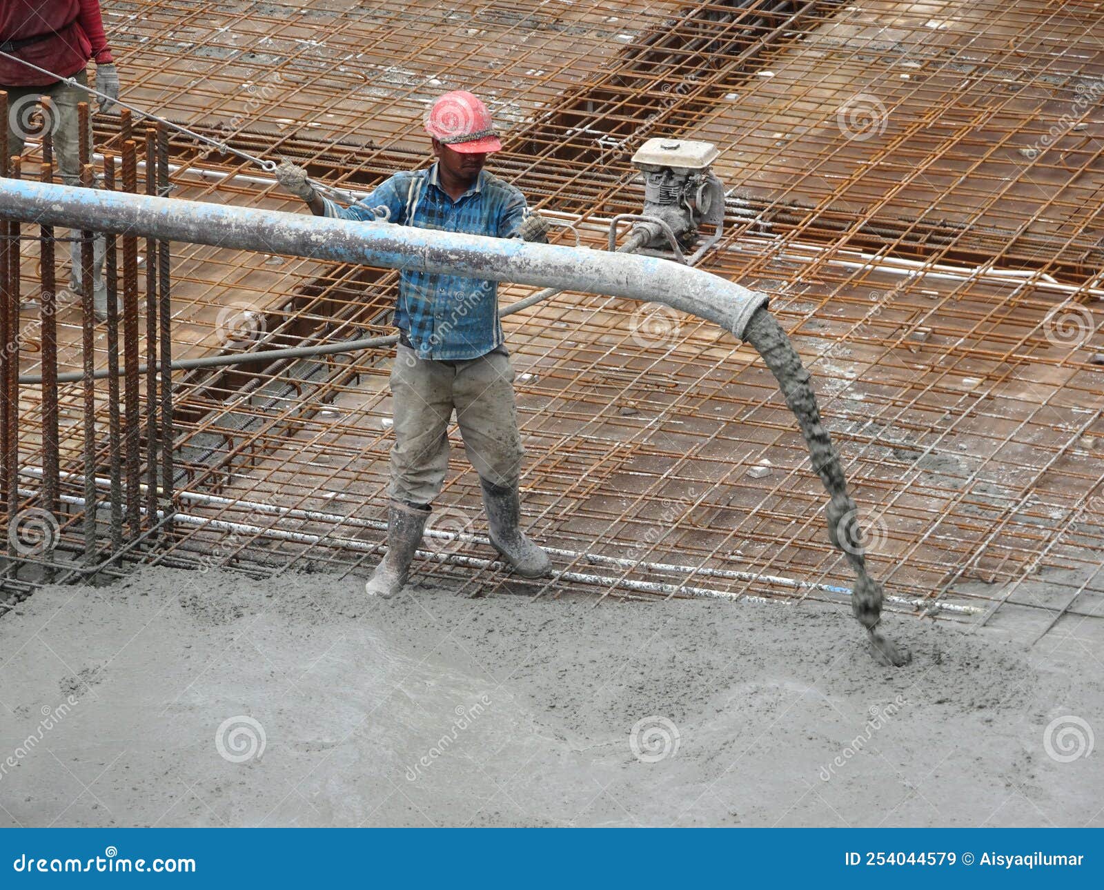 Construction Workers Pour Wet Concrete Using a Hose from the Elephant ...