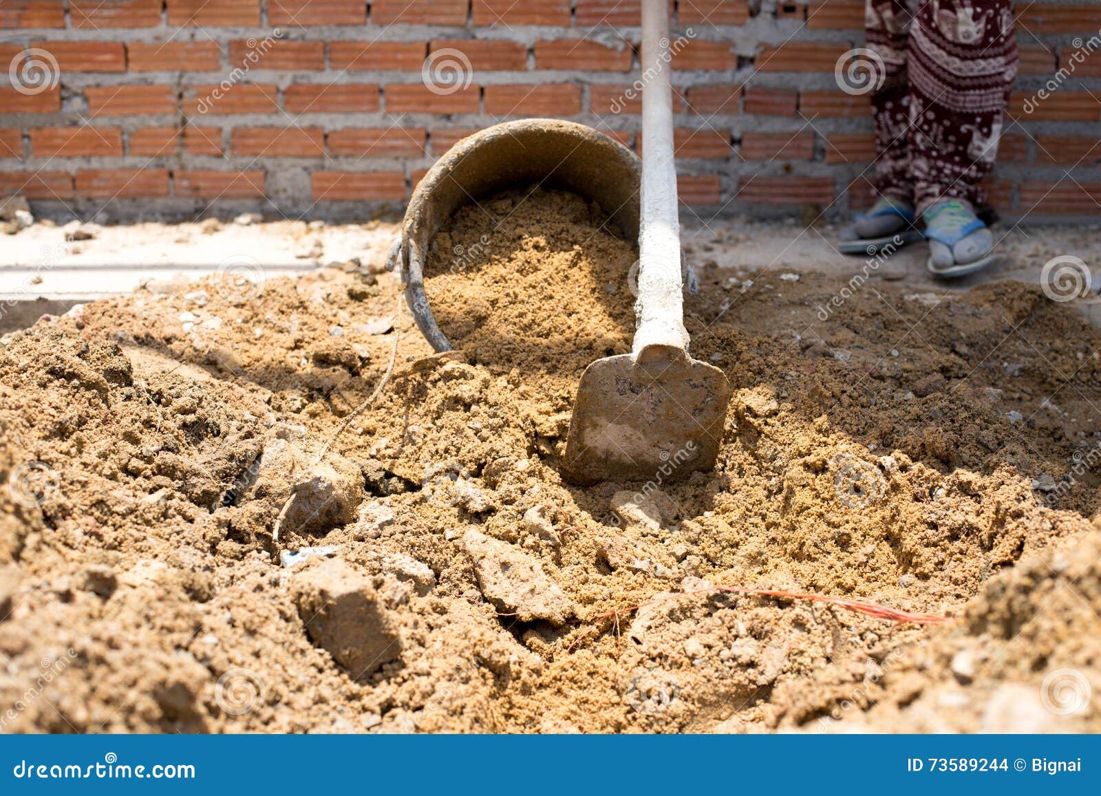 Construction Workers Putting Sand in the Sand Bucket in Building Stock ...