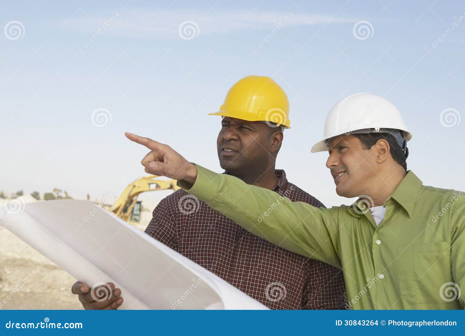 Construction Workers Reading Blueprints Stock Photo - Image of ...