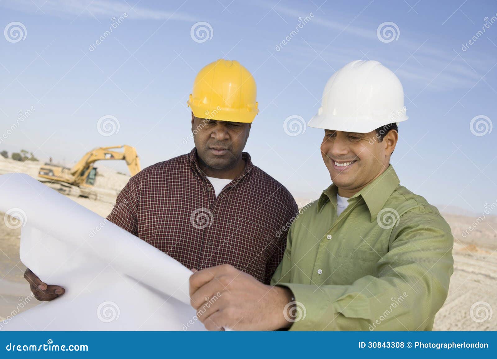 Construction Workers Reading Blueprints Stock Photo - Image of ...