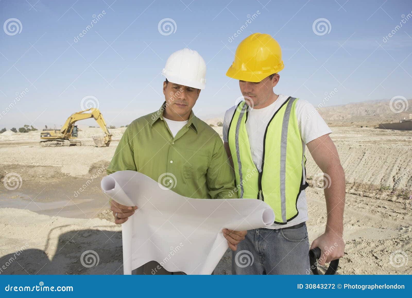 Construction Workers Reading Blueprints Stock Photo - Image of ...
