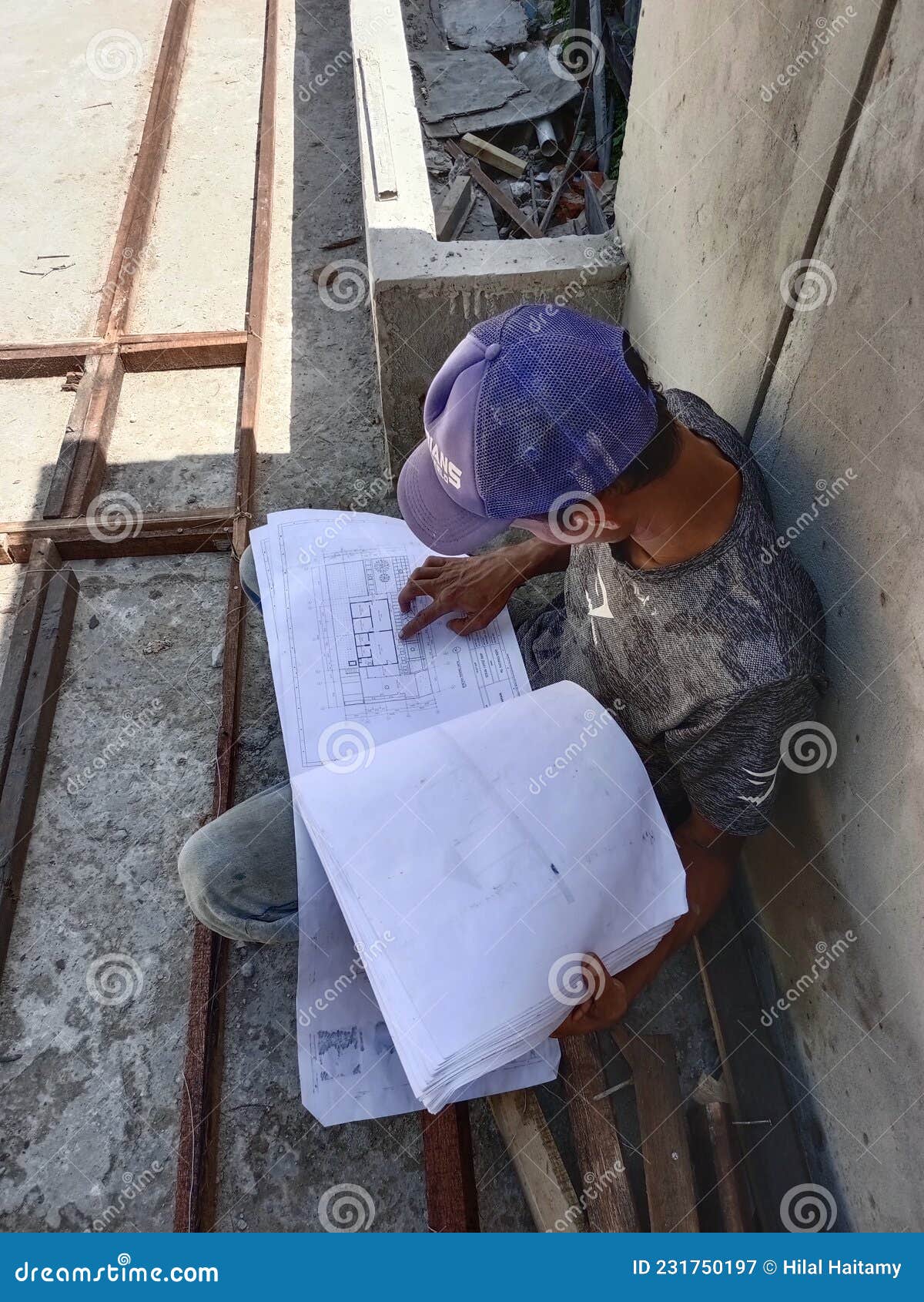 Construction Workers, Reading Project Working Drawings. Editorial ...