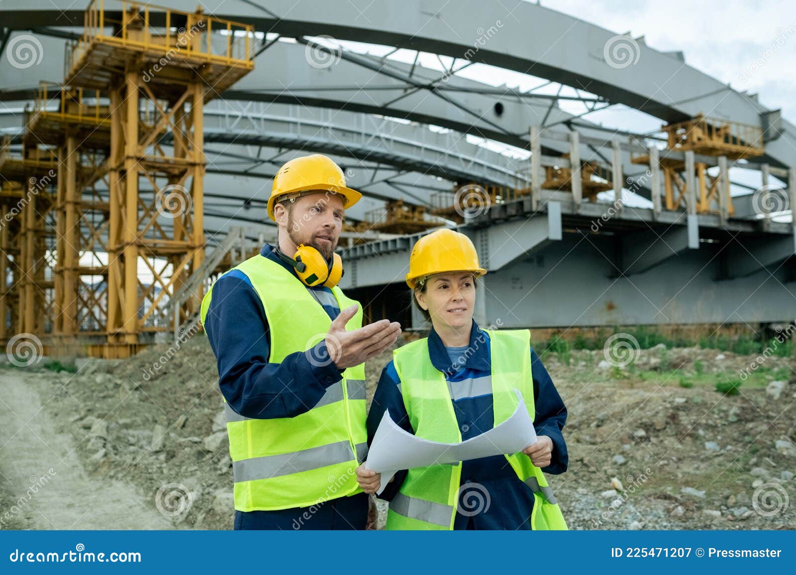 Workers Standing on Construction Site Stock Image - Image of looking ...