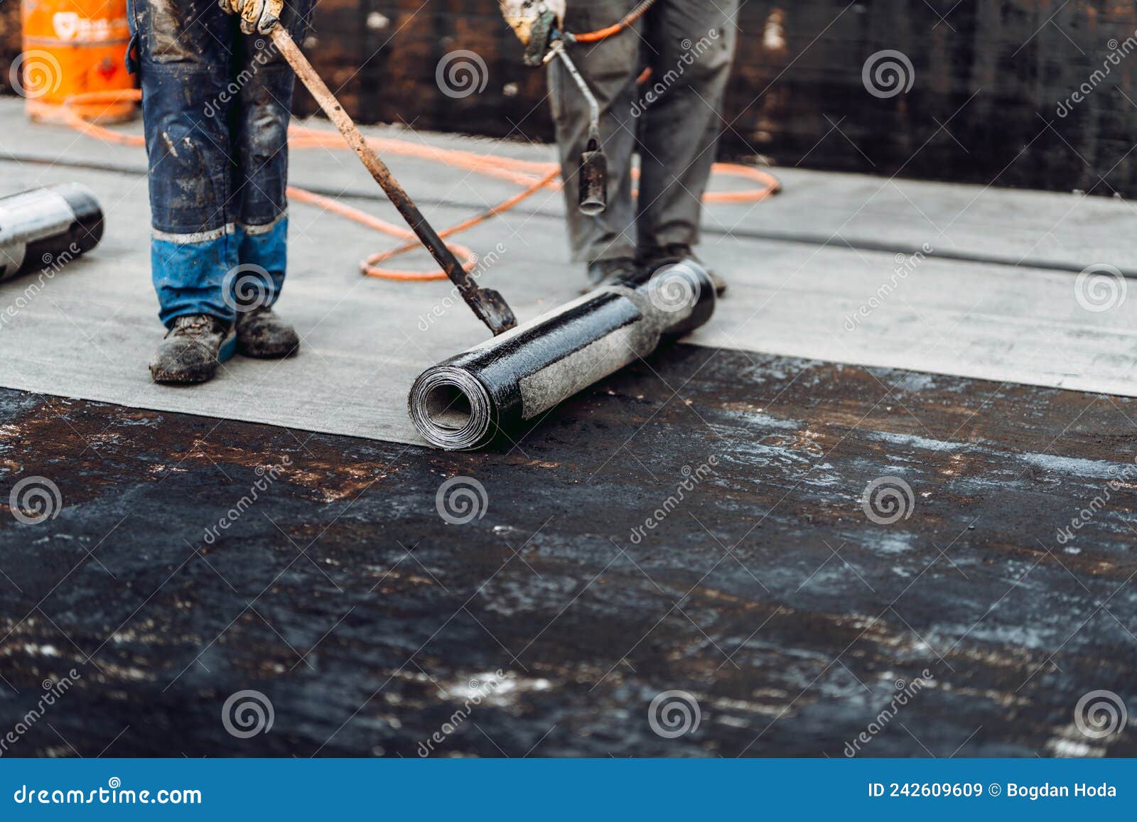 Construction Workers, Roofers Installing Rolls of Bituminous ...