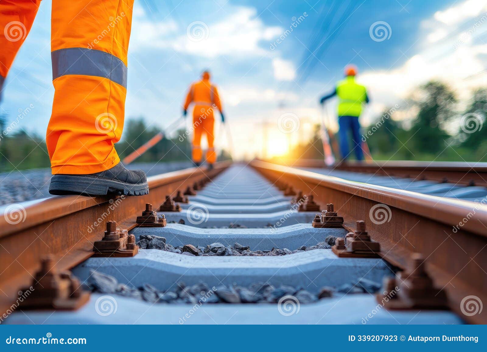 Construction Workers in Safety Gear Inspecting Railway Tracks during ...