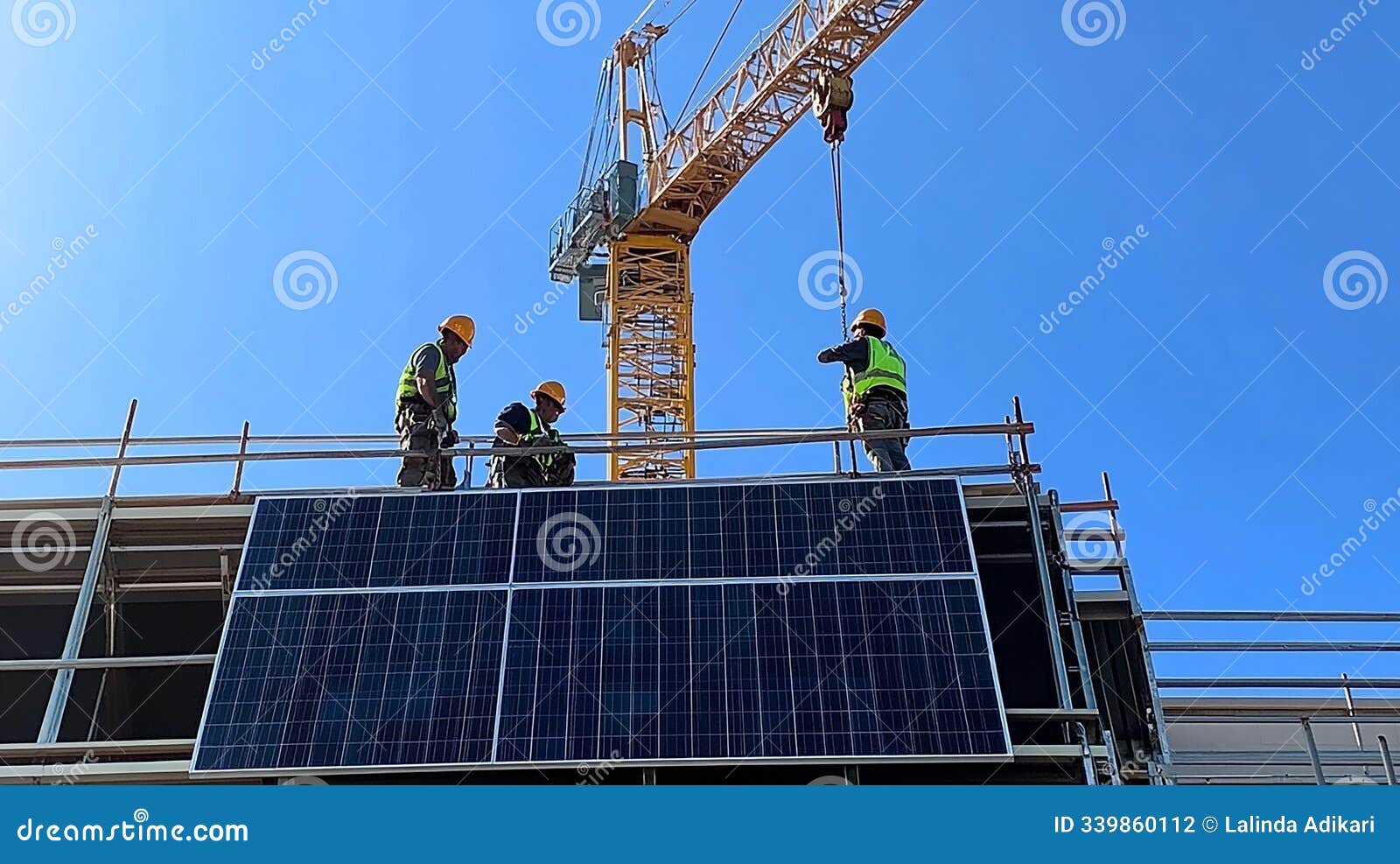 Construction Workers on Scaffolding Securing Solar Panels Stock ...
