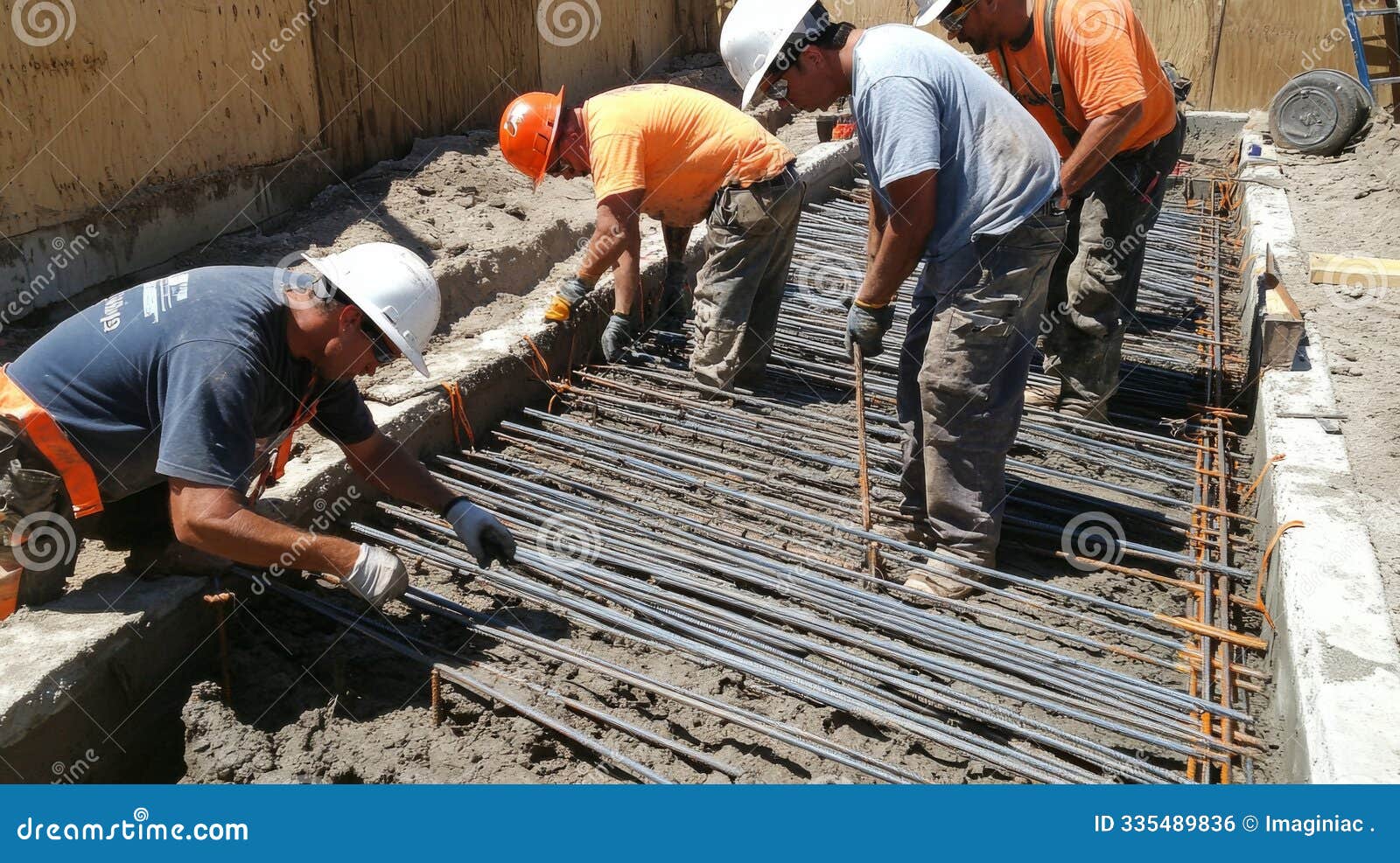 Construction Workers Securing Reinforcing Steel in Concrete Form Stock ...