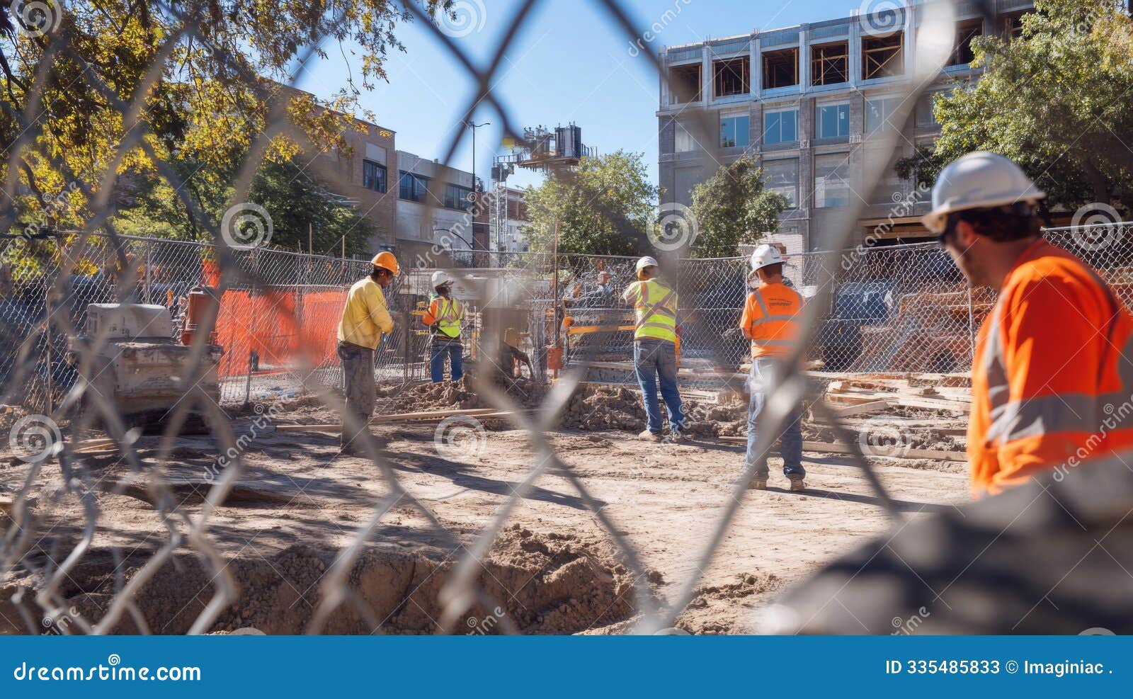 Workers Are Seen Attaching The Winch And Hook To The End Of The Jib ...