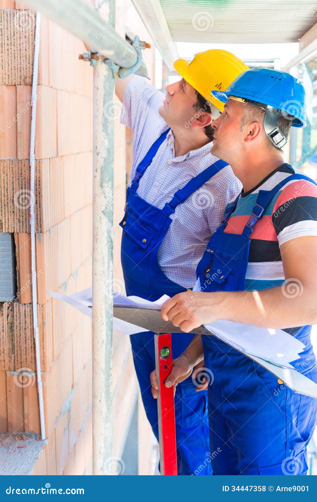 Construction Workers on Site Checking Quality Stock Photo - Image of ...