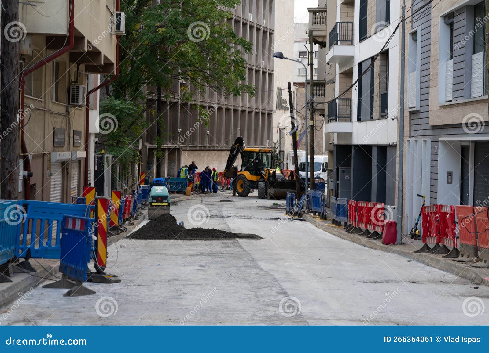 Construction Workers at Construction Site and Heavy Duty Bulldozer in ...