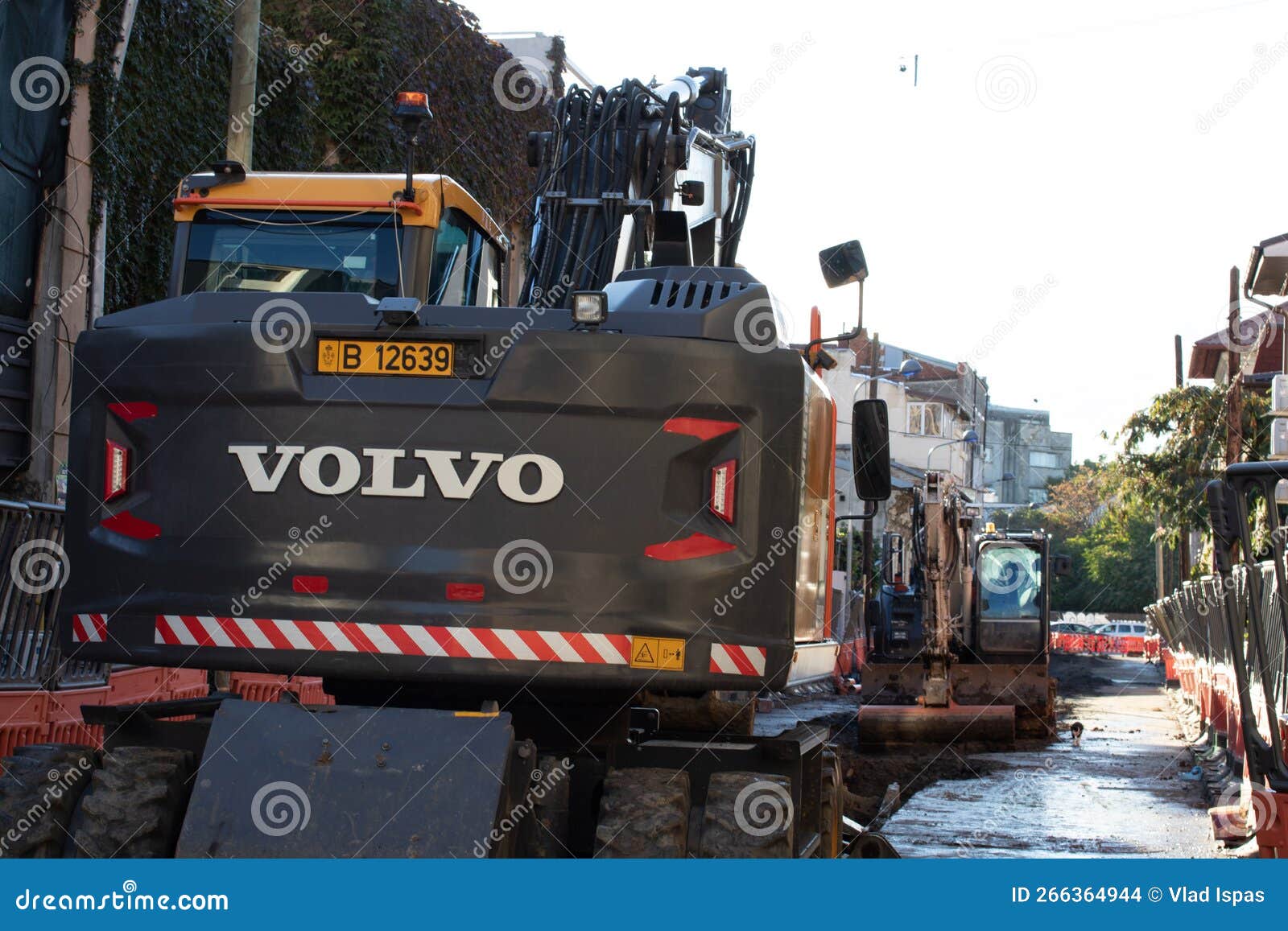 Construction Workers at Construction Site and Heavy Duty Bulldozer in ...