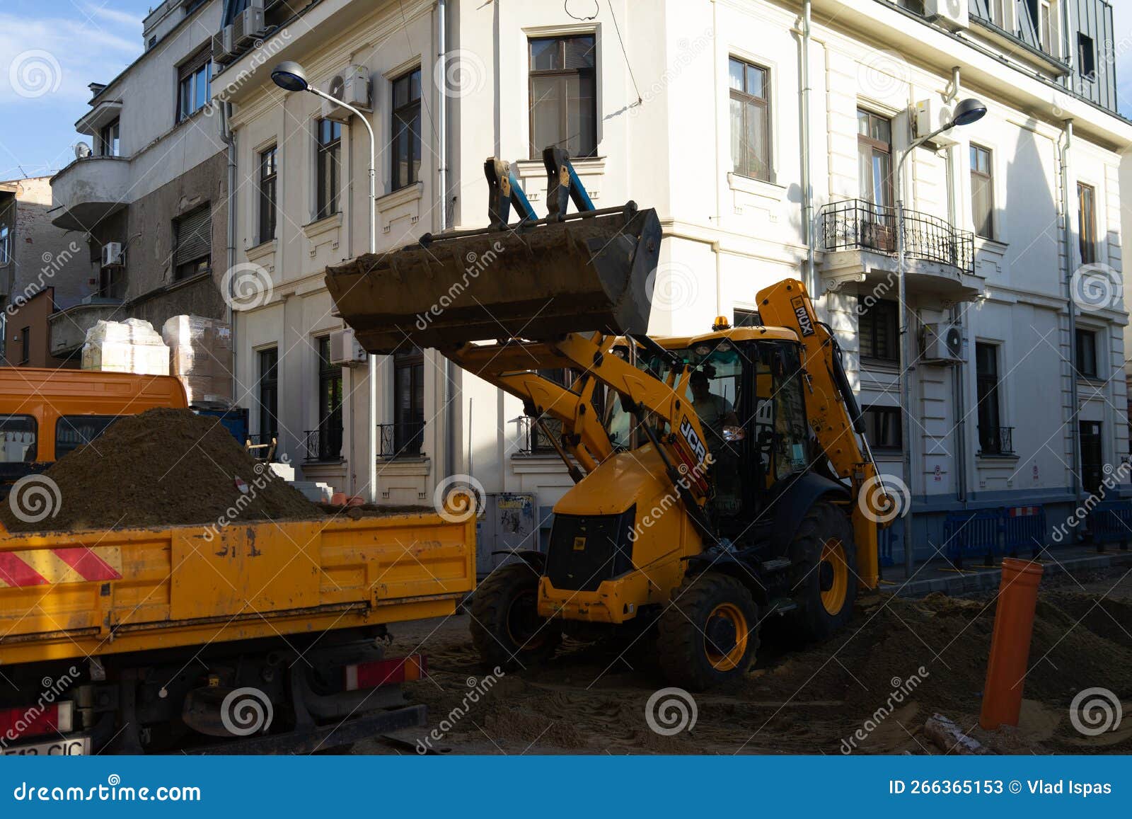 Construction Workers at Construction Site and Heavy Duty Bulldozer in ...