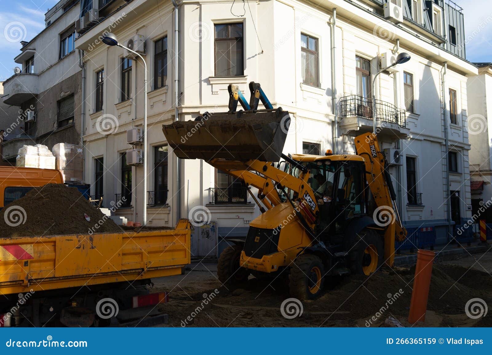 Construction Workers at Construction Site and Heavy Duty Bulldozer in ...