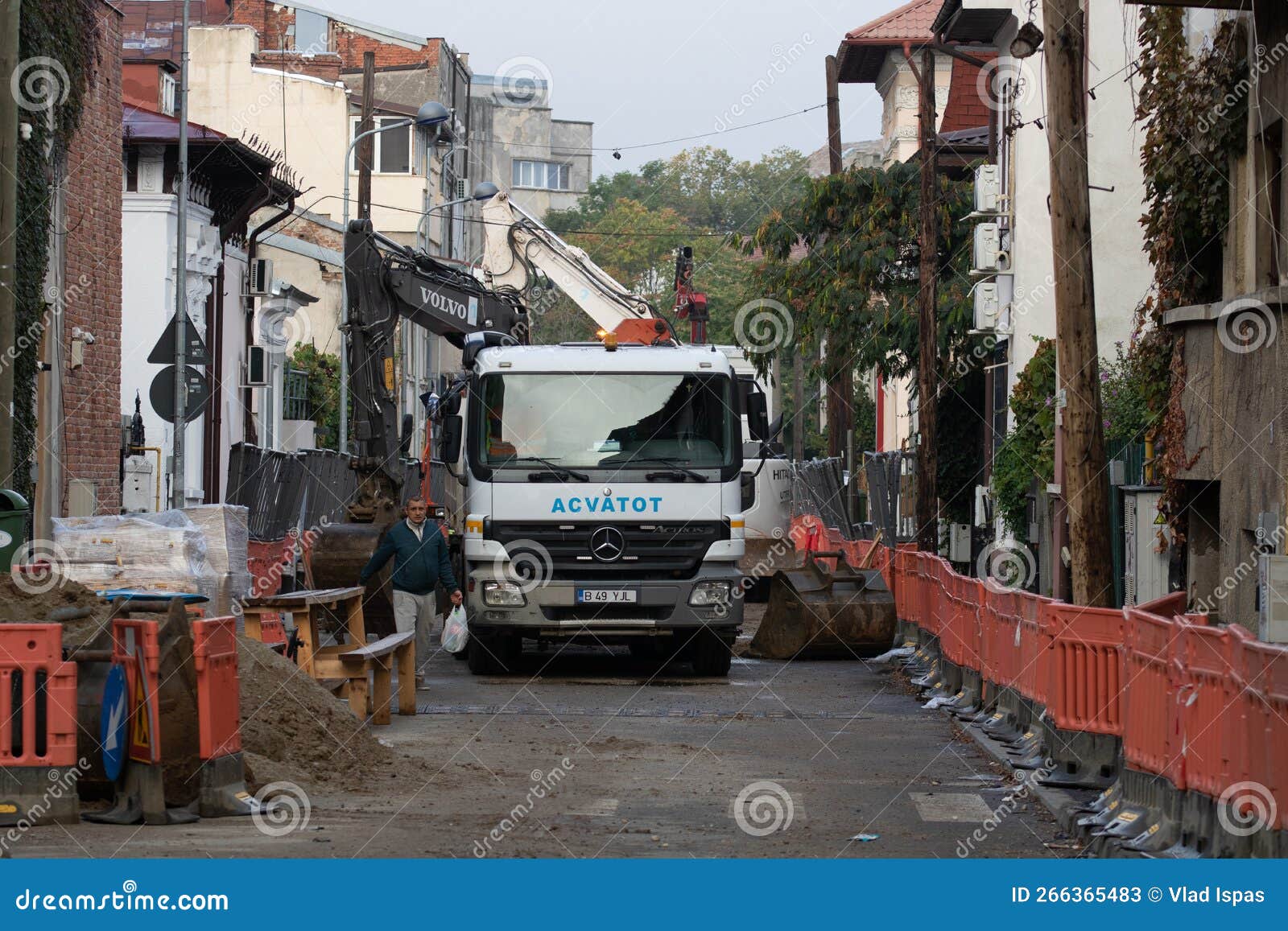 Construction Workers at Construction Site and Heavy Duty Bulldozer in ...